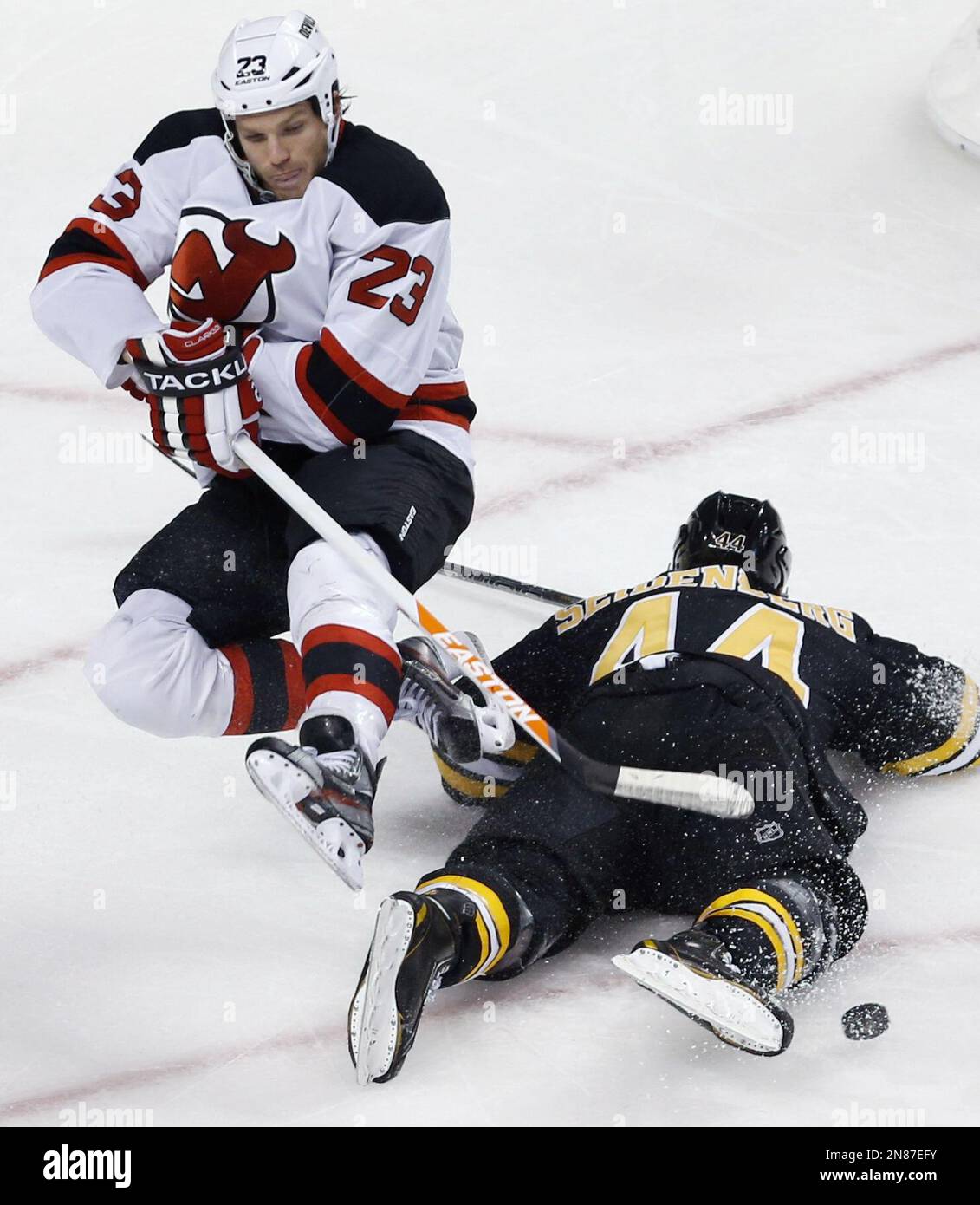 Boston Bruins defenseman Dennis Seidenberg, of Germany, trips New ...