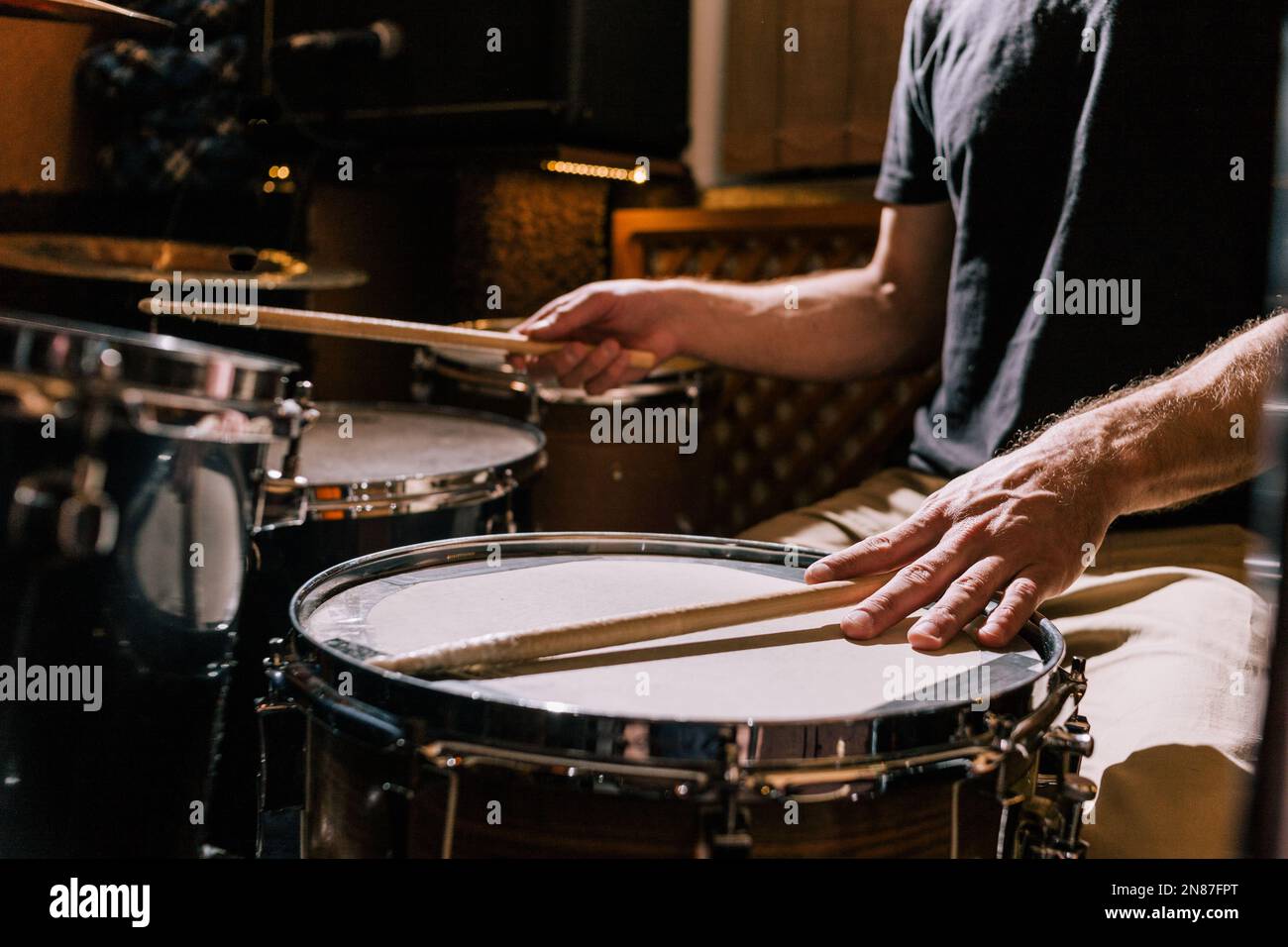 Drummer with drums closeup. Recording studio Stock Photo - Alamy