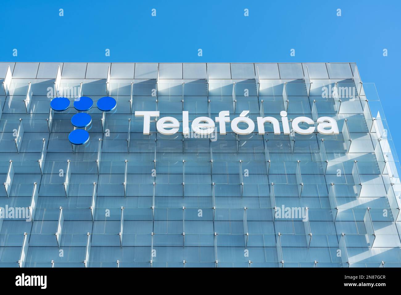 Madrid, Spain, February 4, 2023: Telefonica brand in a glass building ...