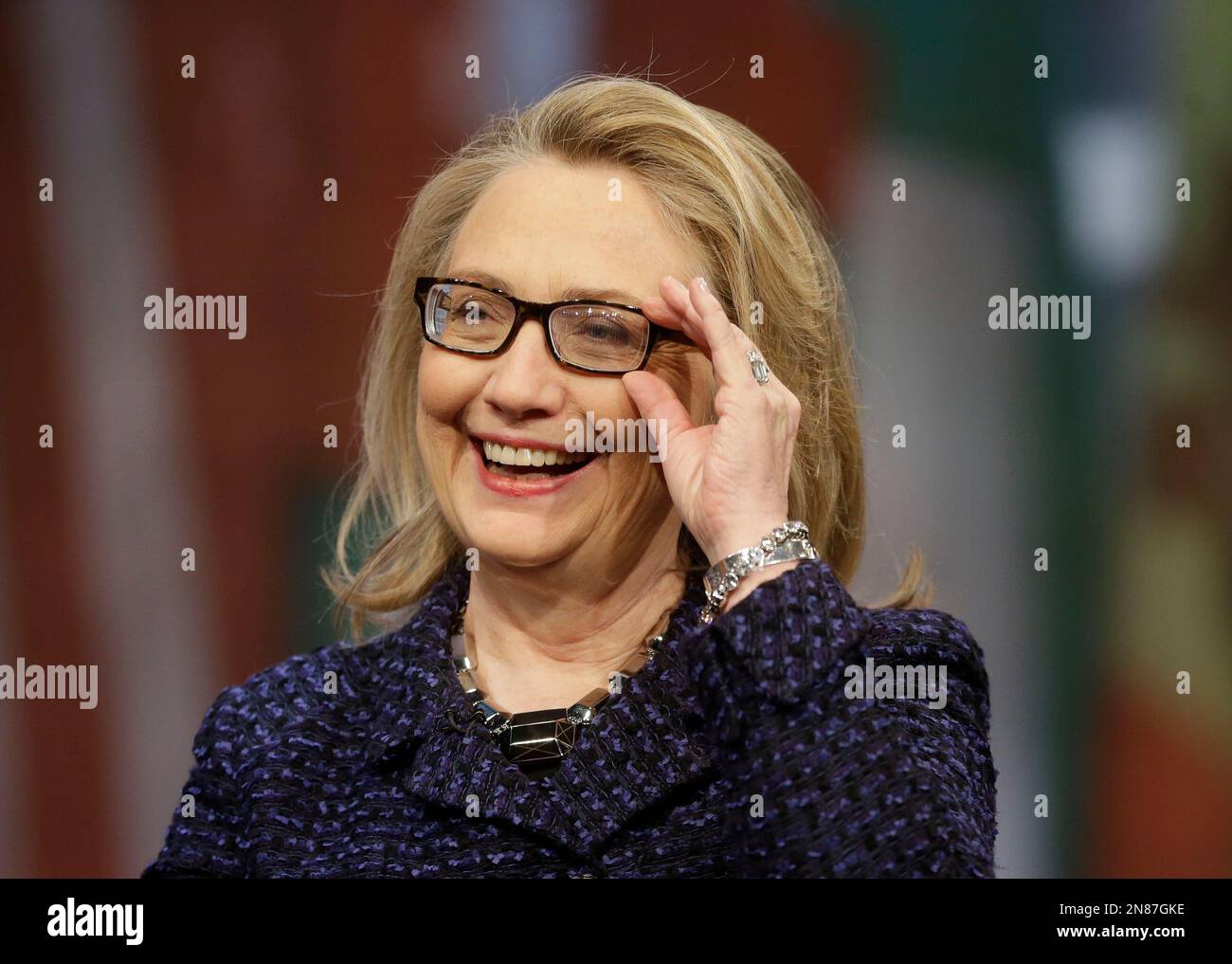 Secretary of State Hillary Rodham Clinton adjusts her glasses during a ...