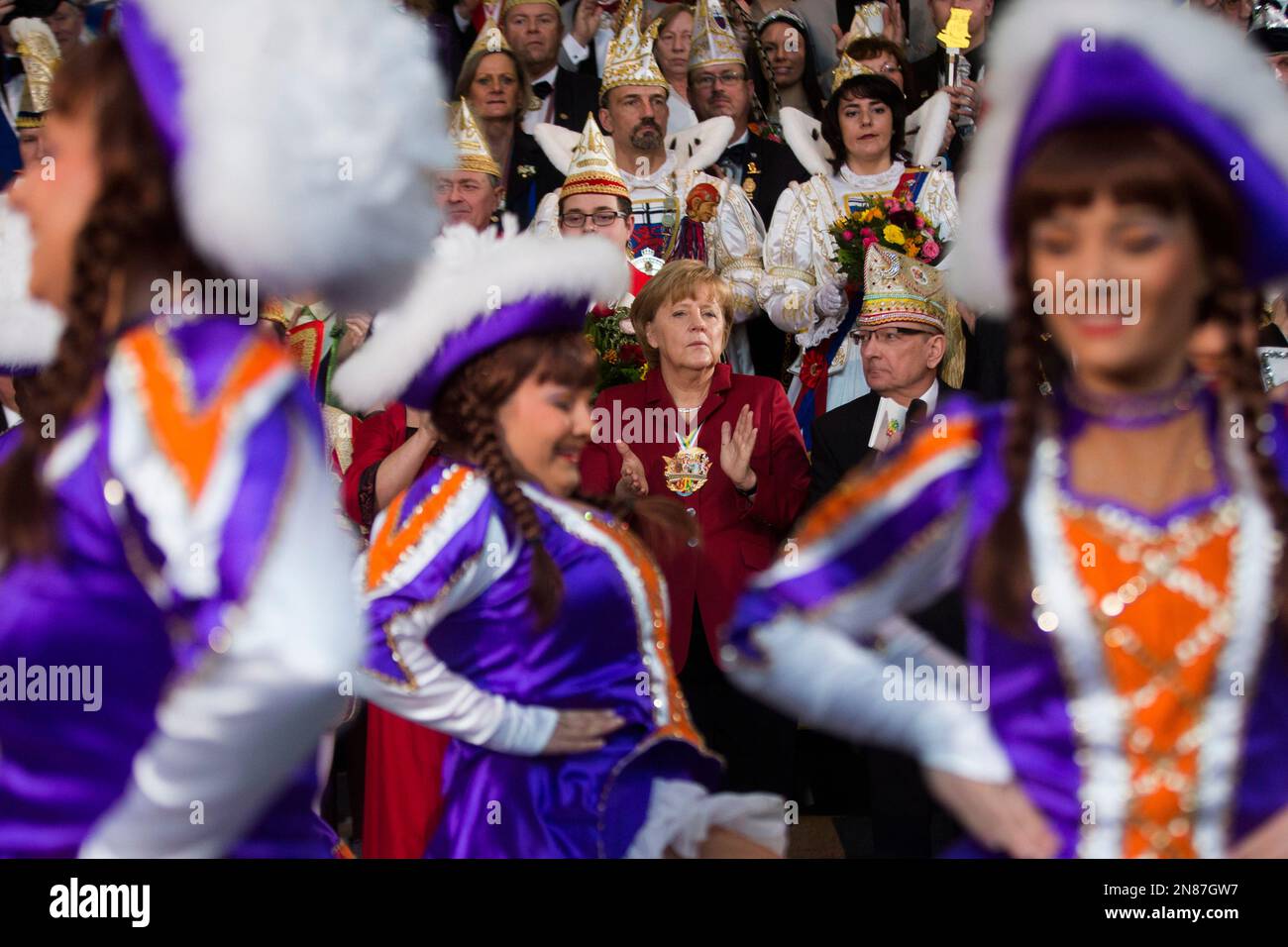 German Chancellor Angela Merkel, center, watches a performance of ...