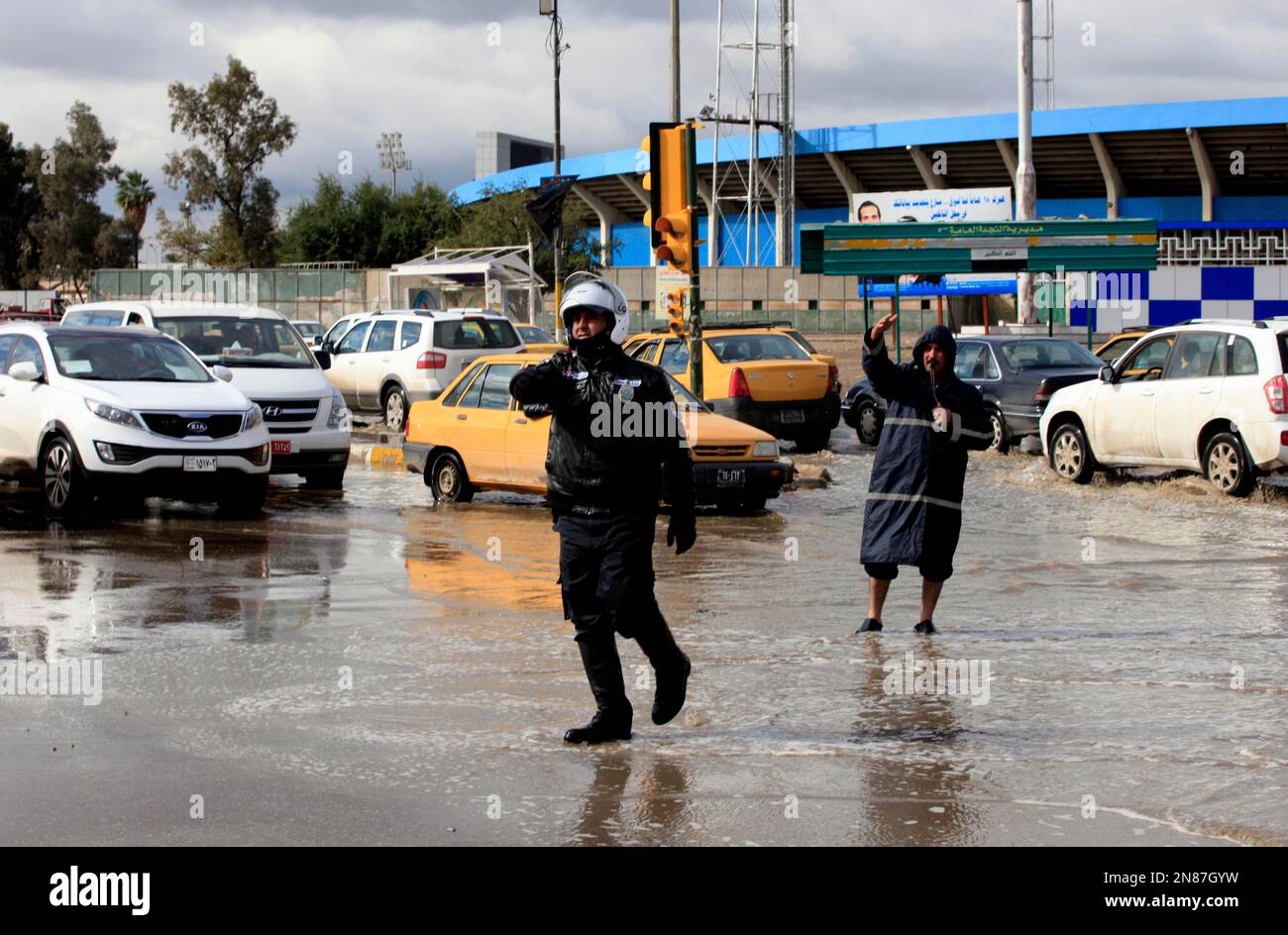 Iraqi traffic police officers control traffic in Baghdad, Iraq, Tuesday ...
