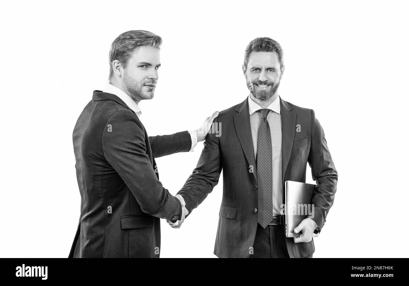 two businessmen colleagues shaking hands after successful business deal ...