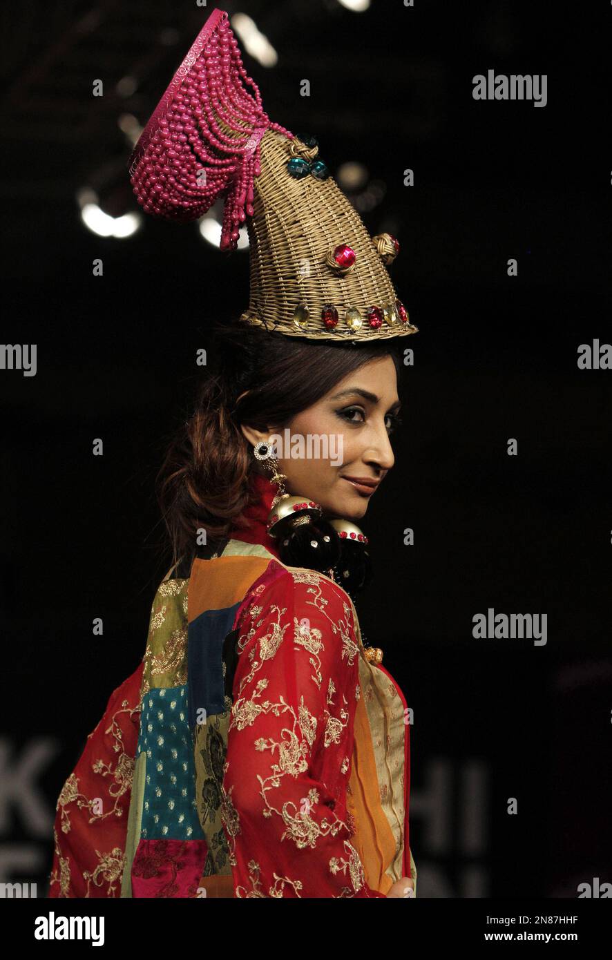 A Pakistani model presents a creation of designer duo, Faisal and ...