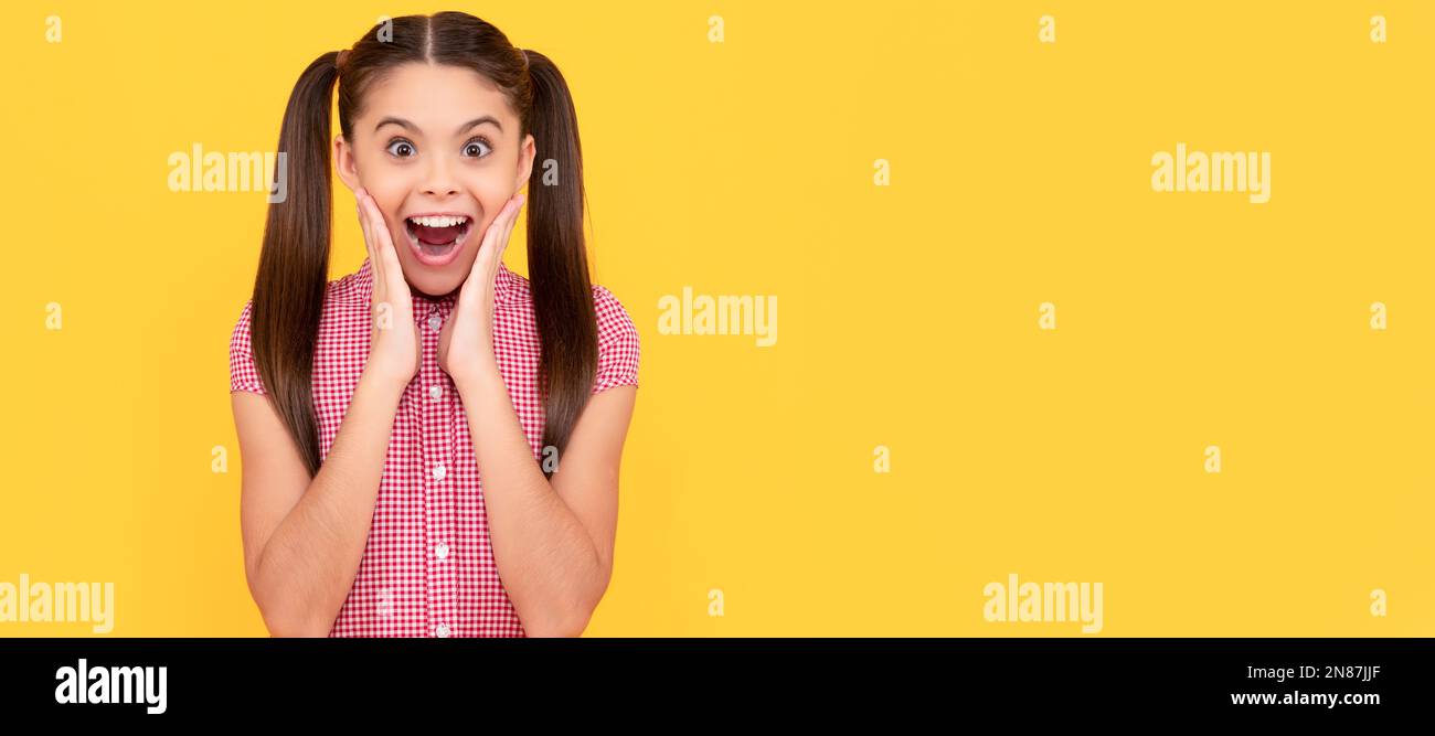Shocked eye-popping tween girl show surprise yellow background, OMG ...