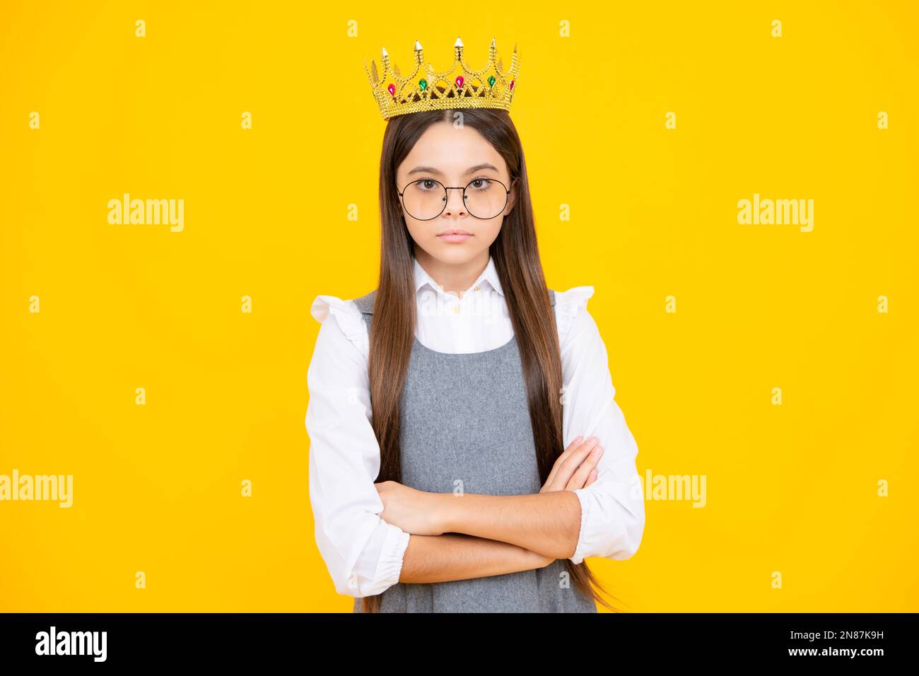 Girls birthday party, funny kid in crown. Imagine herself a queen ...