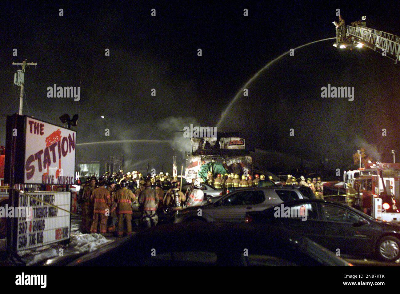 FILE - In this Feb. 21, 2003 file photo, firefighters spray water on ...