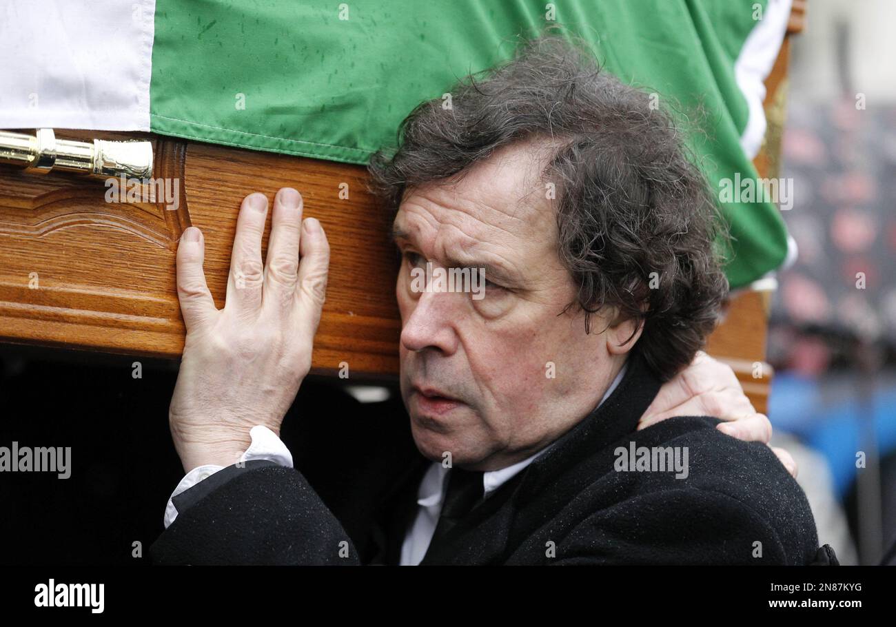 Actor Stephen Rea carries the coffin of his ex-wife, Dolours Price at ...