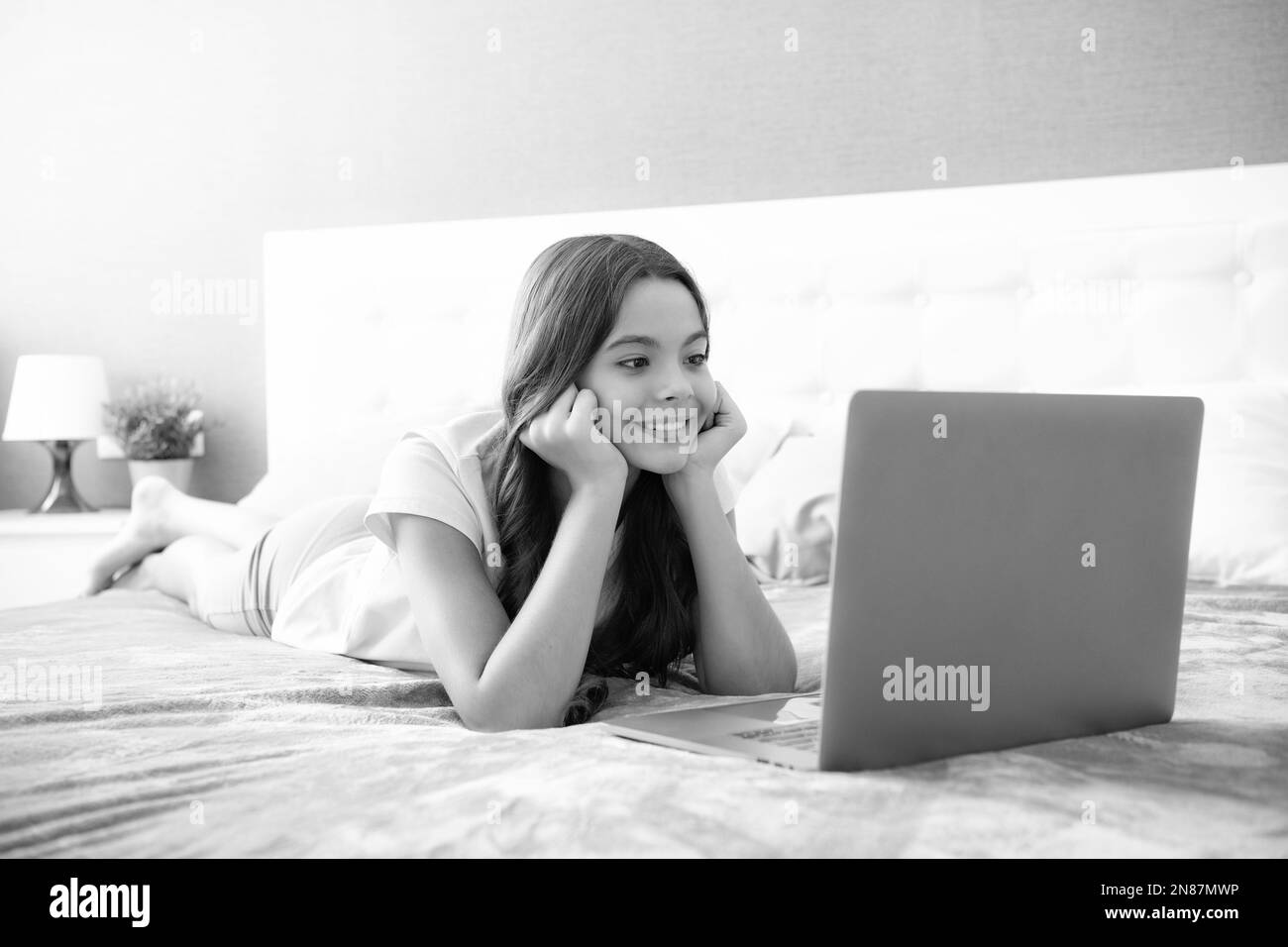 Young teenage girl, little student studying virtual course, learning ...