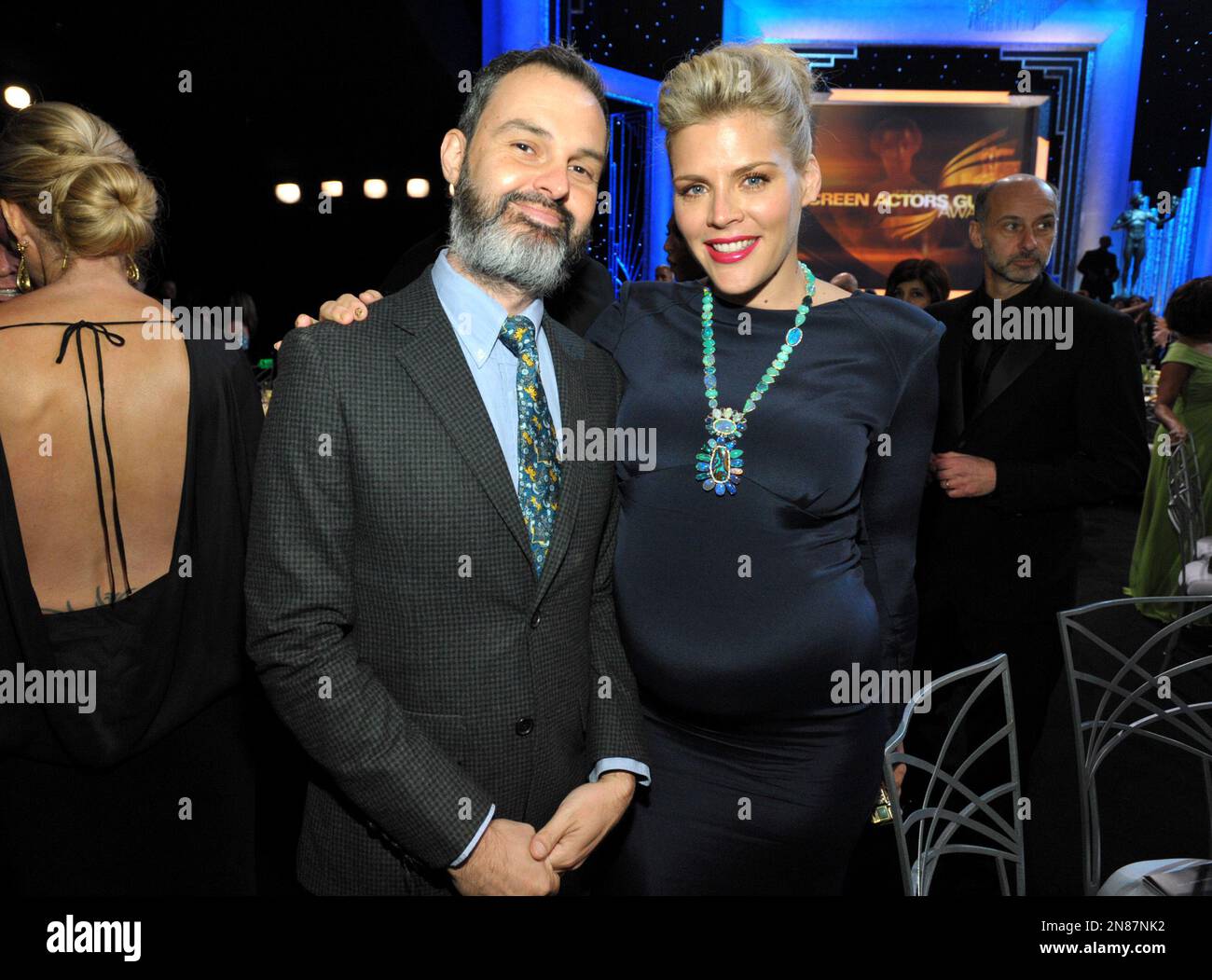 Marc Silverstein, left, and Busy Philipps pose in the audience at the ...