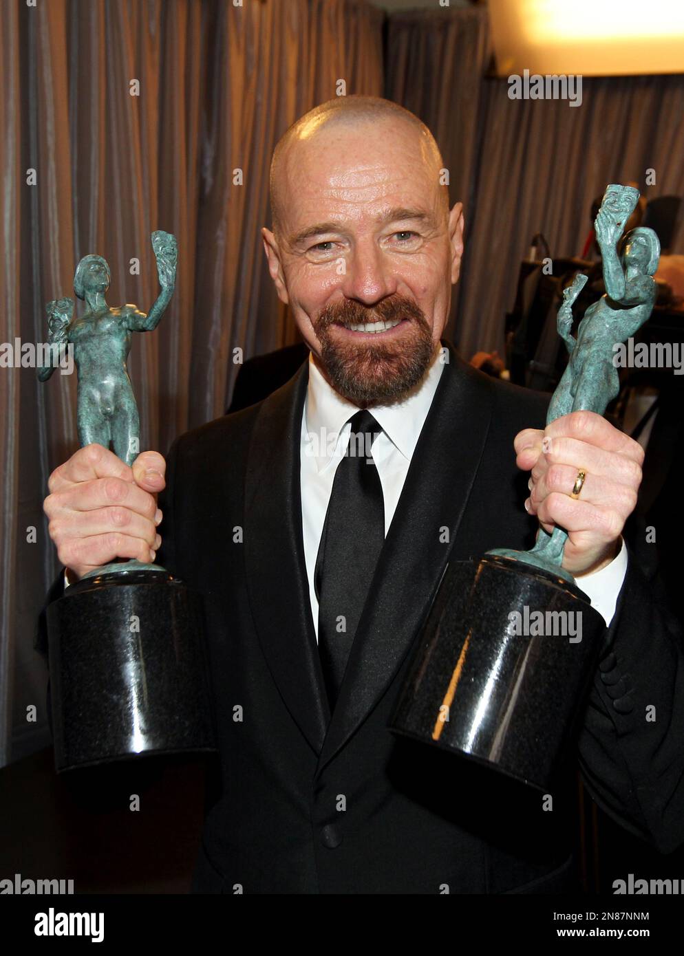 Bryan Cranston poses backstage with the award for outstanding male ...