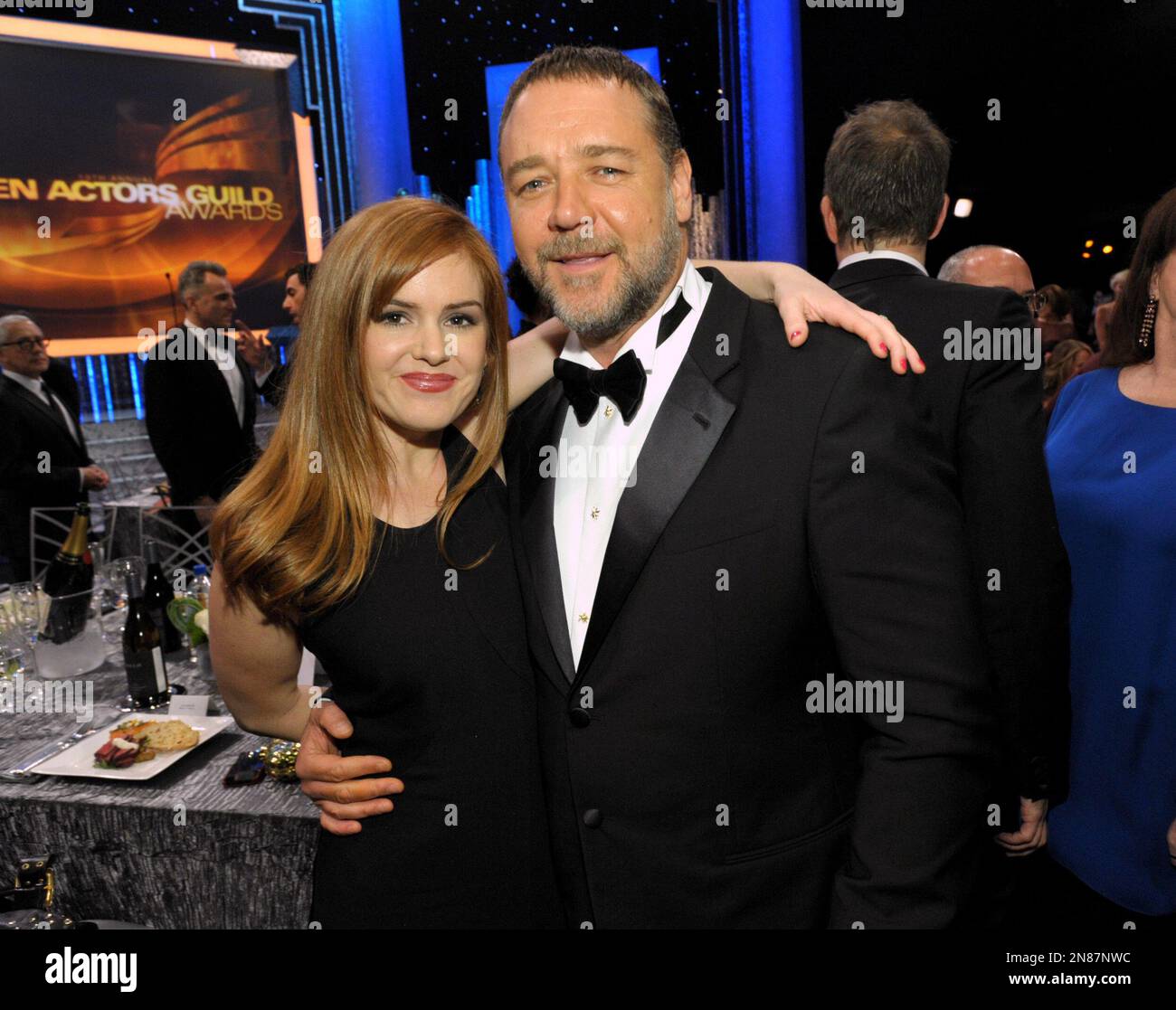 Isla Fisher, left, and Russell Crowe pose in the audience at the 19th ...