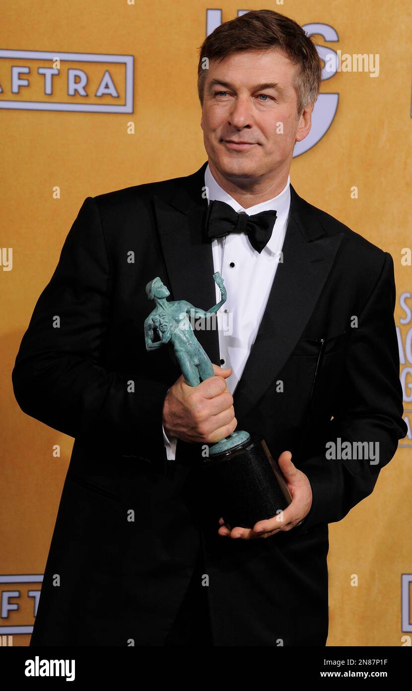 Actor Alec Baldwin poses backstage with the award for best make actor ...