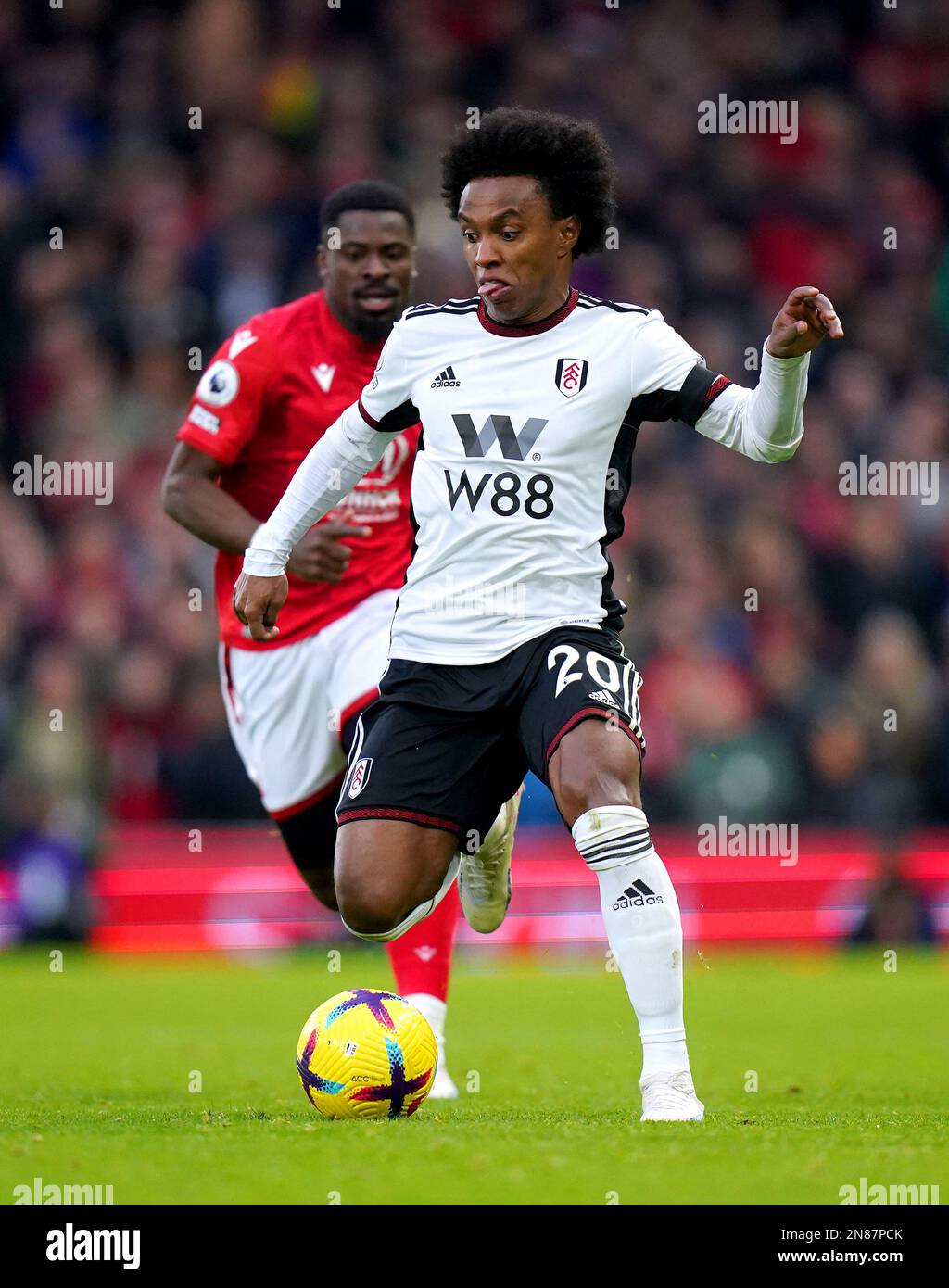 Fulham's Willian controls the ball during the Premier League match at ...