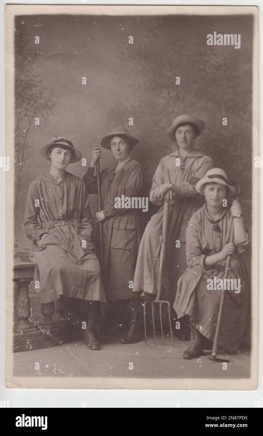 First World War Women's Land Army: portrait of four woman in work ...