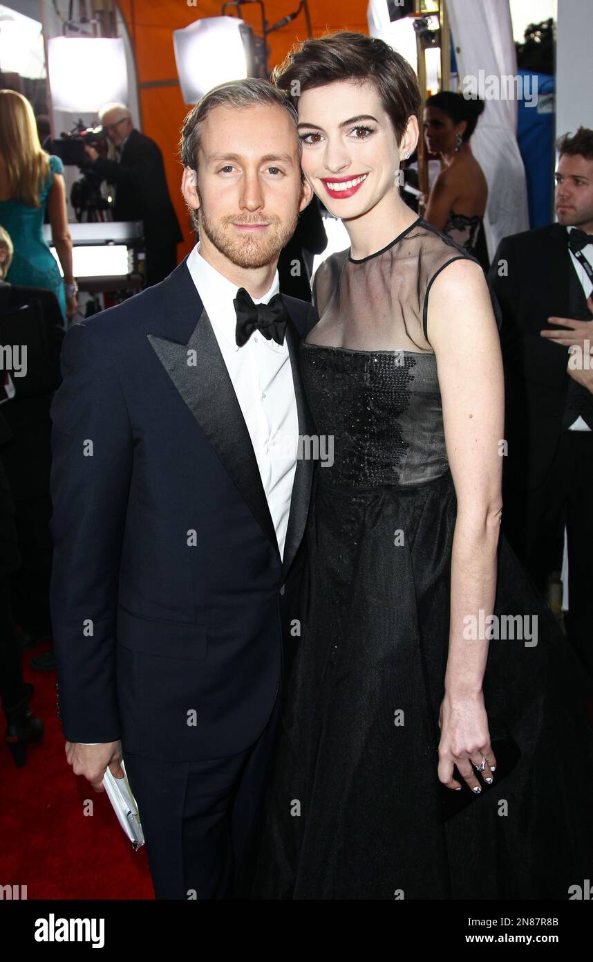 Adam Shulman, left, and actress Anne Hathaway arrive at the 19th Annual ...