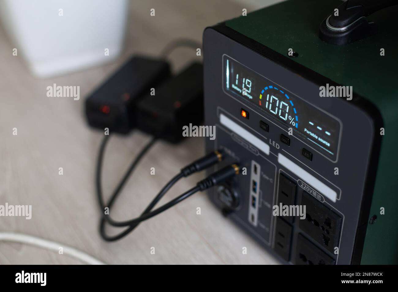 Portable Power Station is charging gadgets. Modern, information ...