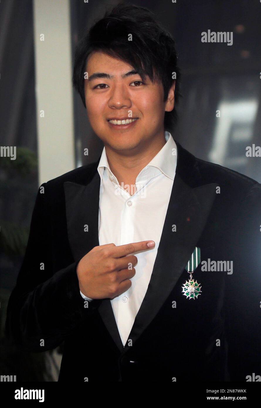 Chinese pianist Lang Lang poses after receiving his Chevalier in the ...