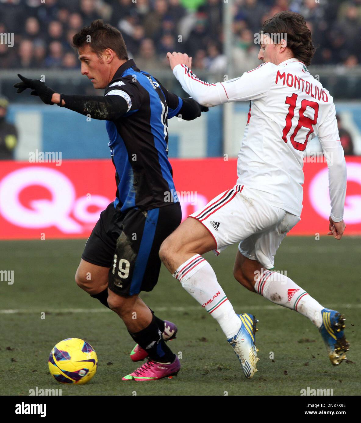 Atalanta's forward German Denis, left, of Argentina, is chased by AC ...