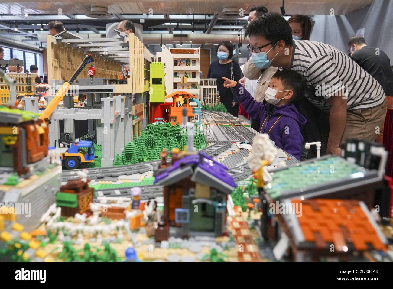 People admire construction built with Lego toy bricks at Hong Kong ...