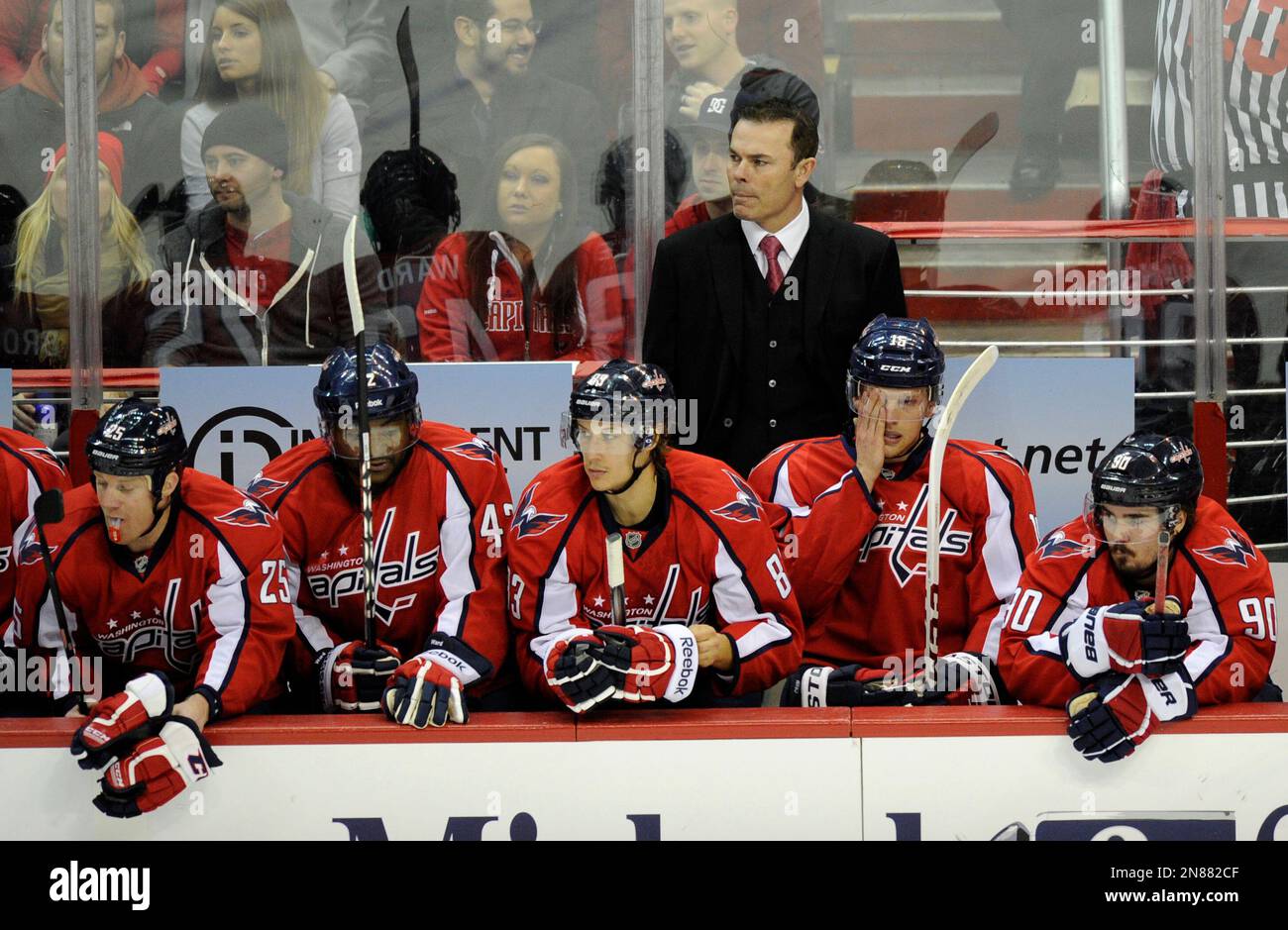 Washington Capitals head coach Adam Oates, top, looks on during the ...