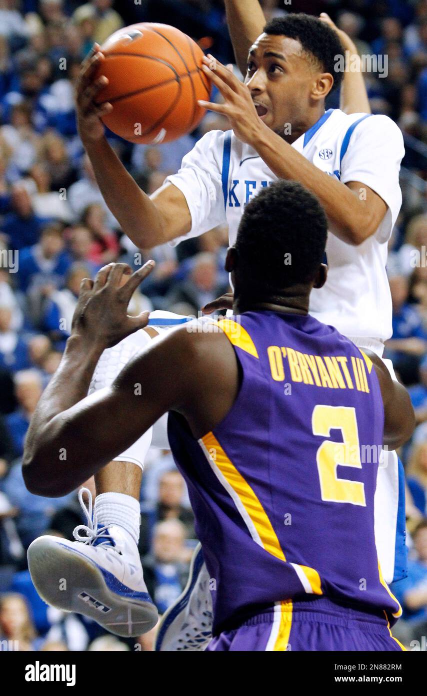 Kentucky's Ryan Harrow, top, looks for a shot over LSU's Johnny O ...