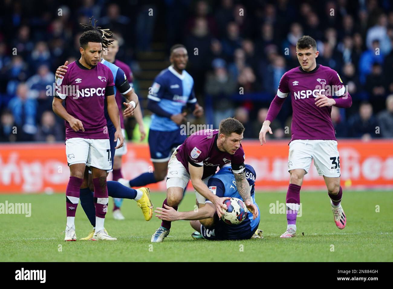 Derby County's James Collins (centre) and Wycombe Wanderers' Joe ...