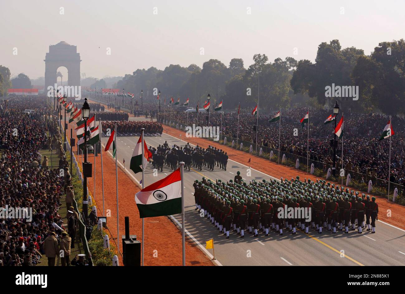 Indian army soldiers march in formation towards the landmark India Gate ...