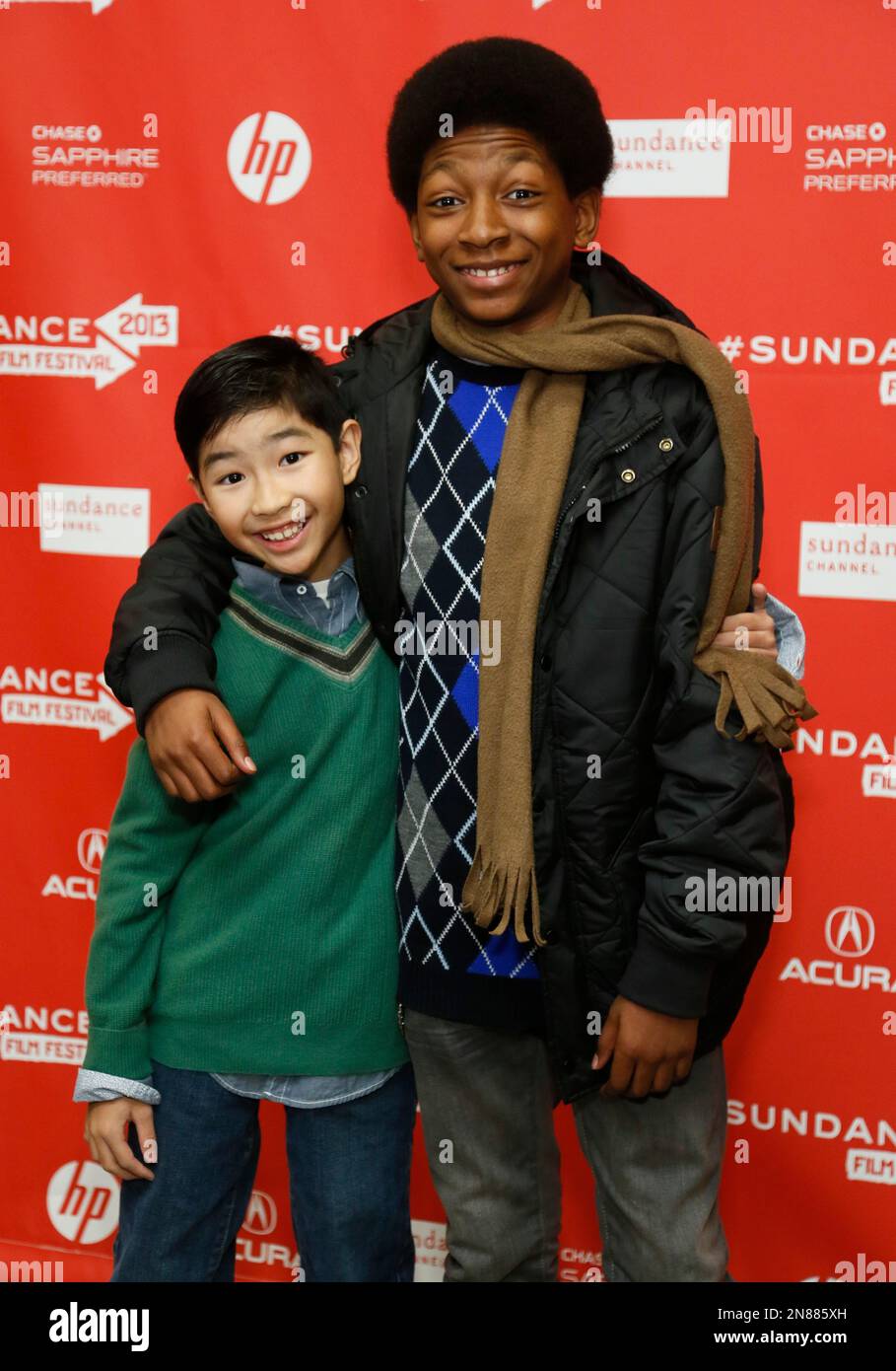Cast members Ethan Dizon, left, and Skylan Brooks, right, pose together ...