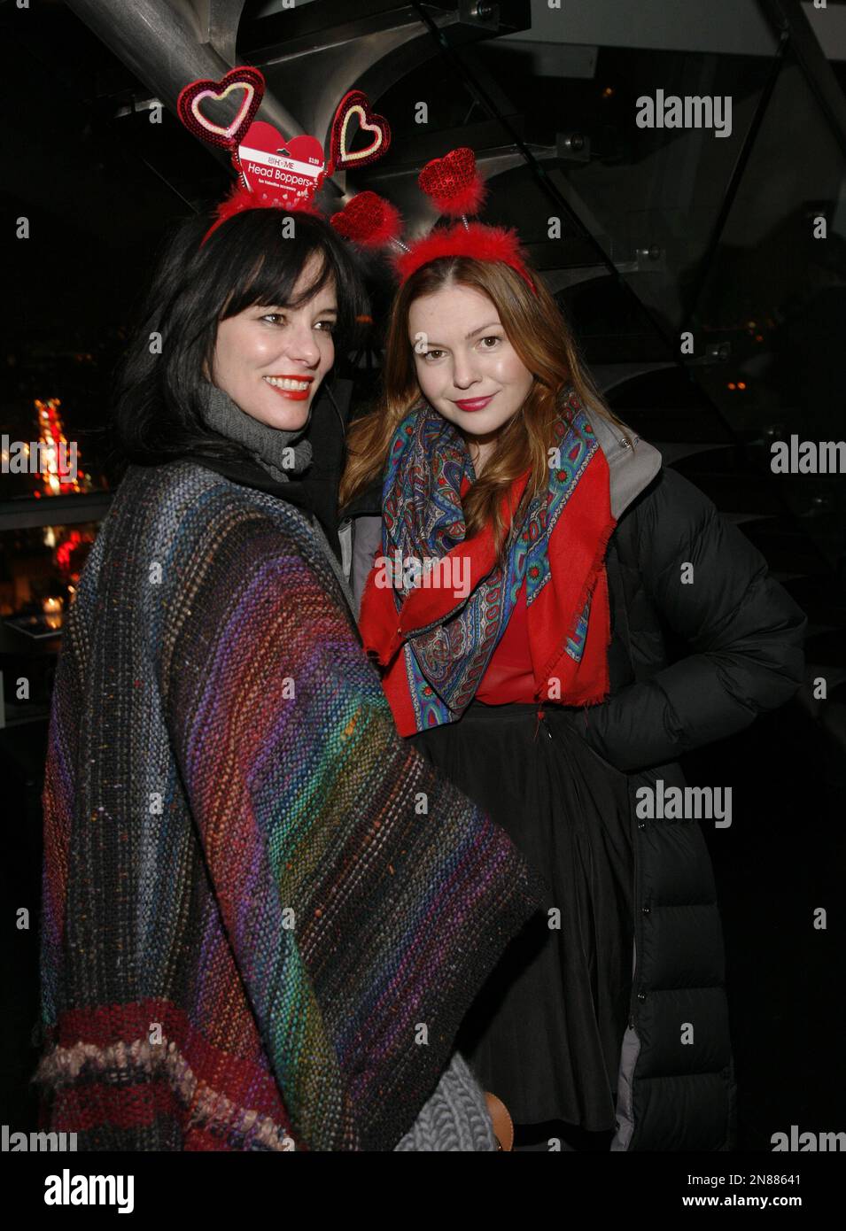 Actresses Parky Posey, left, and Amber Tamblyn, right, attend the "Warm ...