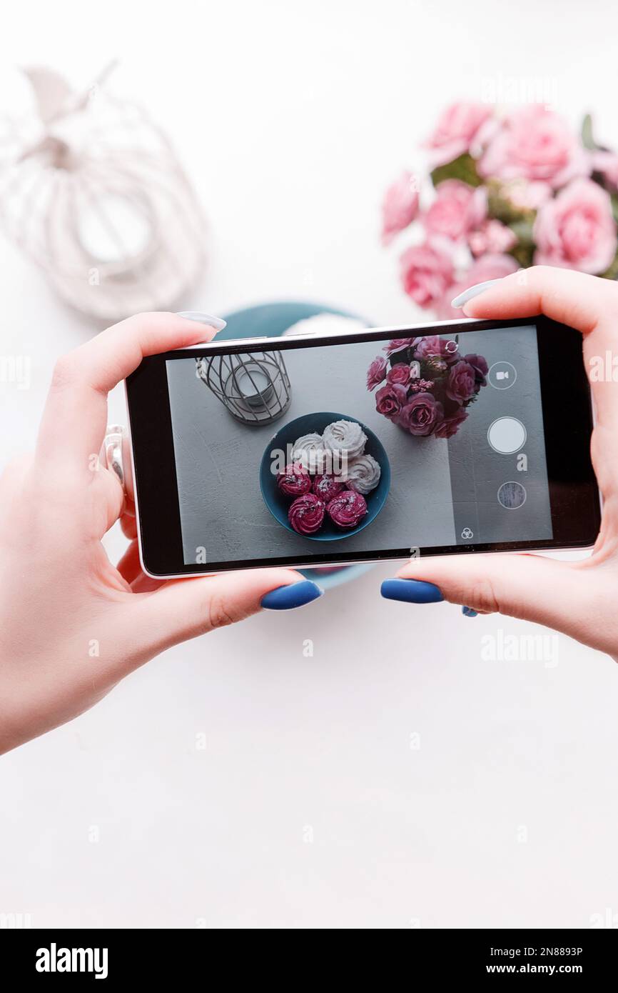 Person shooting sweets Stock Photo - Alamy