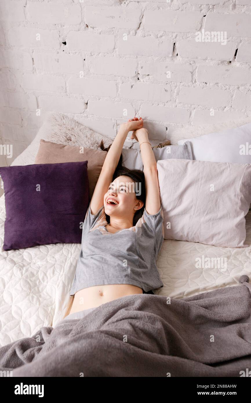 Woman wake up start stretching hi-res stock photography and images - Alamy