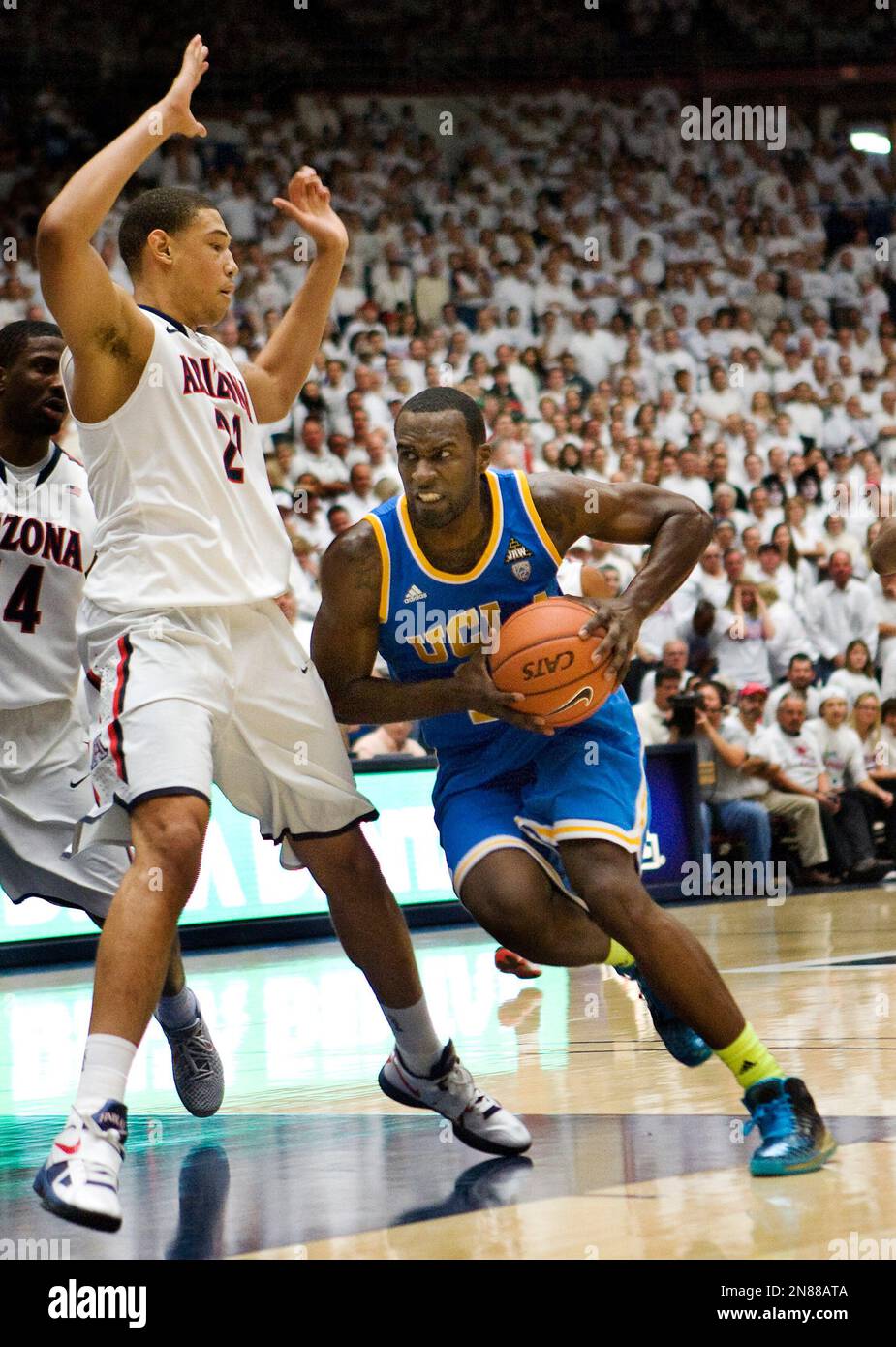UCLA's Shabazz Muhammad, right, drives in the lane against Arizona's ...