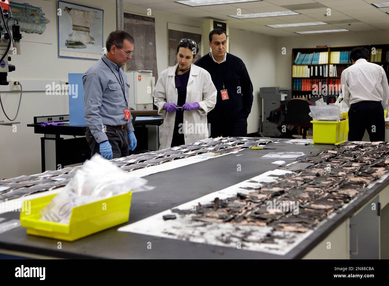 National Transportation Safety Board investigators and metallurgists ...