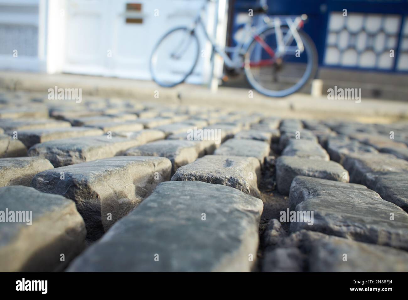 Old Pavement. Close up of old gray pavement with bike in blured on ...