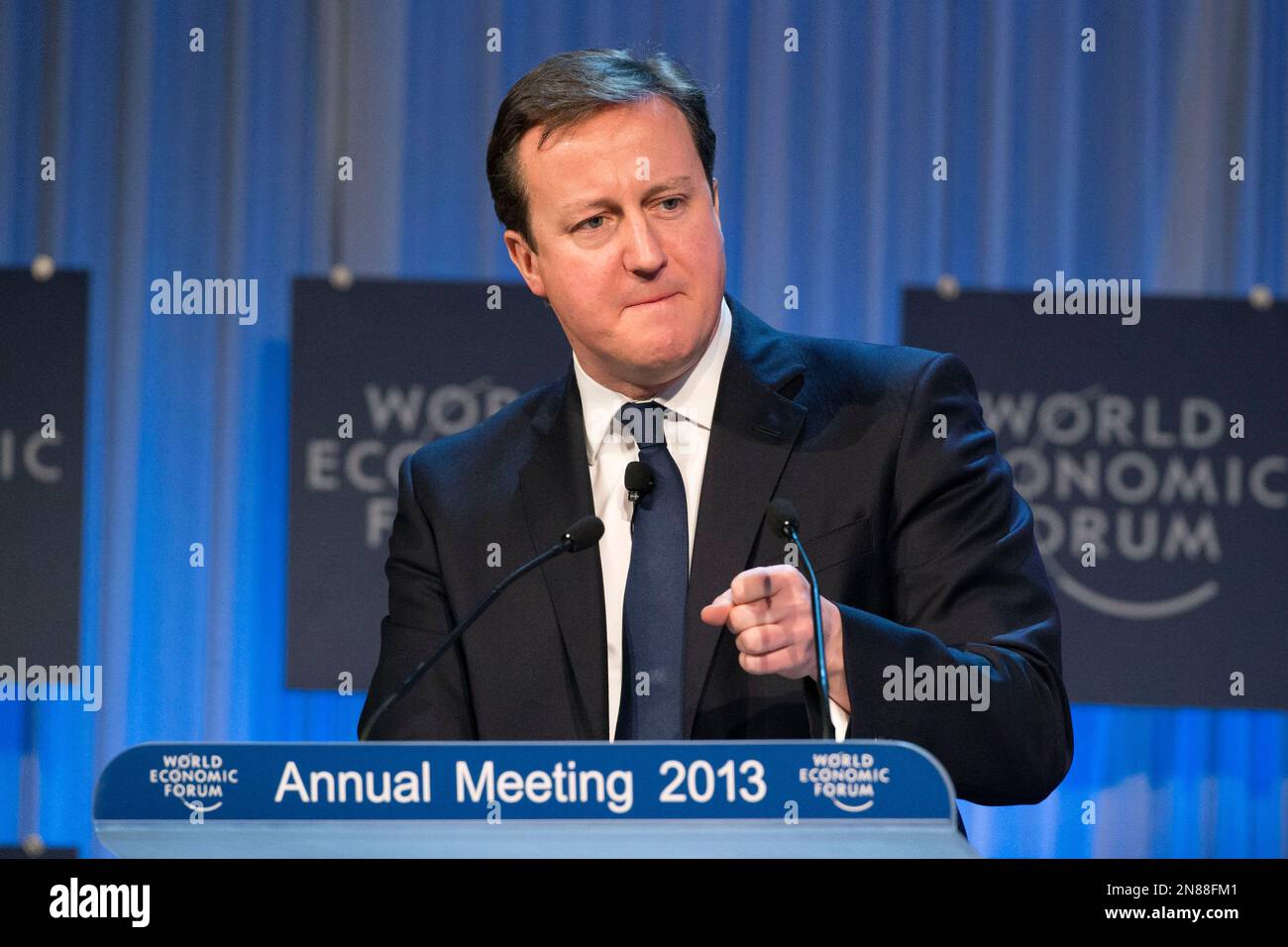 British Prime Minister, David Cameron, gestures as he speaks to the ...
