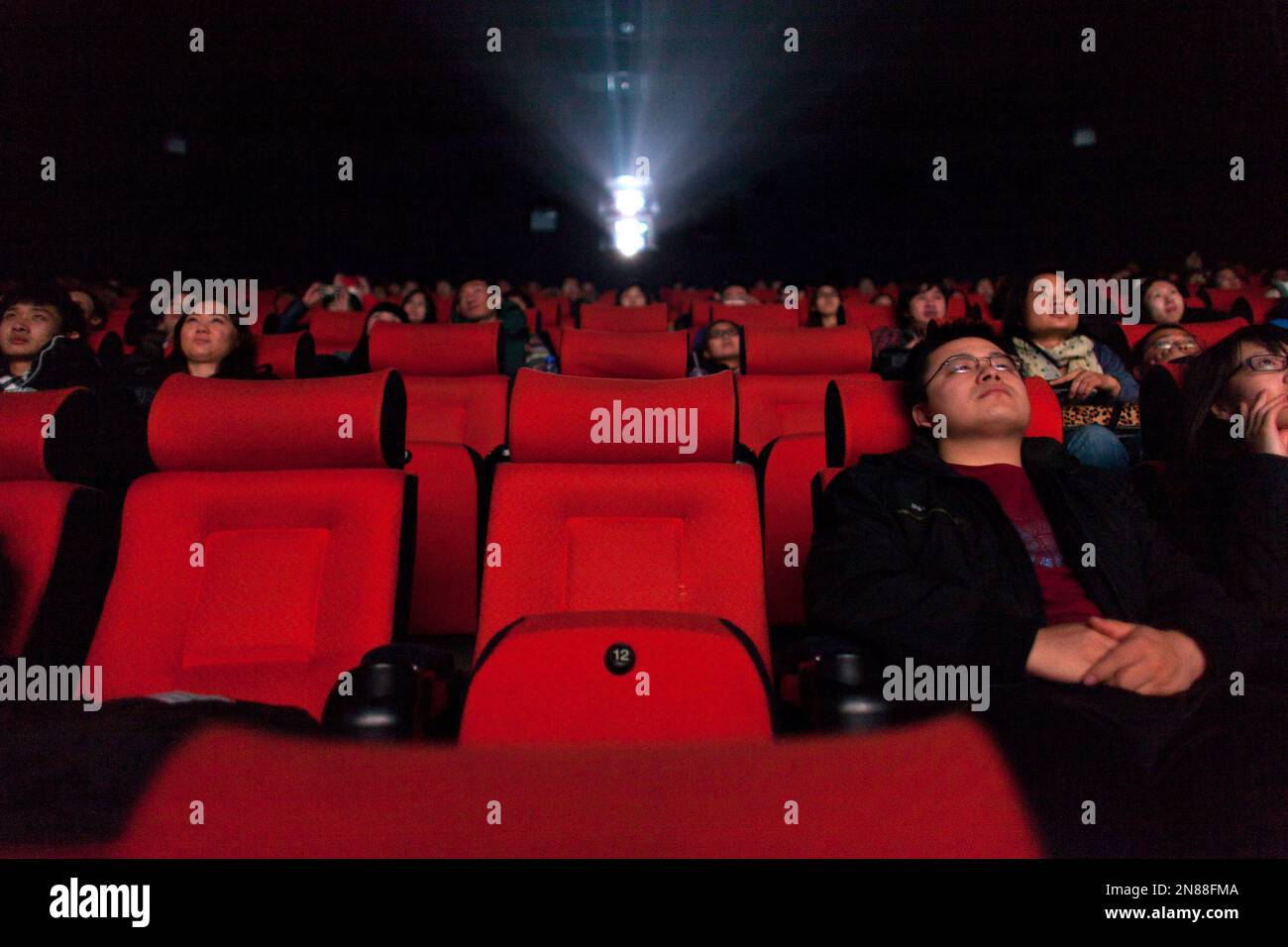 In this Jan. 16, 2013 photo, moviegoers and journalists watch the ...