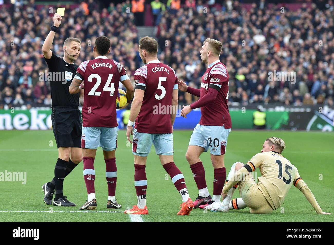 Referee craig pawson shows yellow card hi-res stock photography and ...