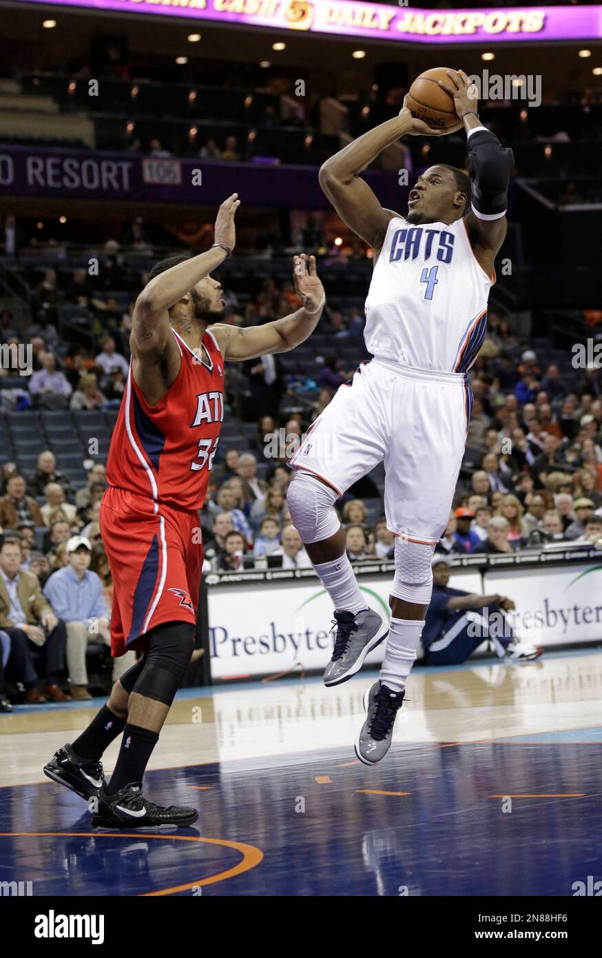 Charlotte Bobcats' Jeff Adrien (4) shoots over Atlanta Hawks' Mike ...
