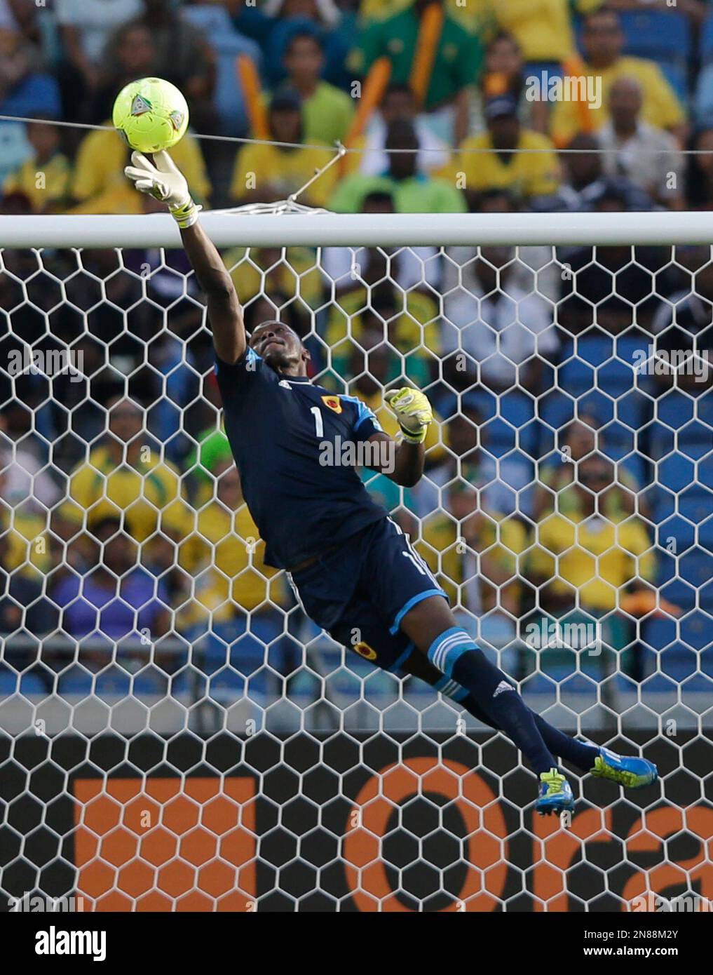 Angola's goalkeeper Lama deflects a shot by South Africa, in their ...