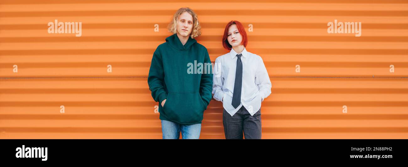 Portraits of two caucasian teen friends boy and girl posing for photo ...