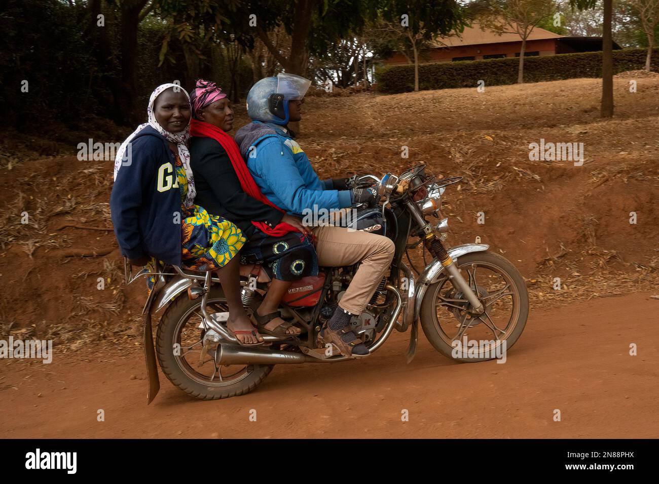 Three people riding a motorcycle hi-res stock photography and images ...