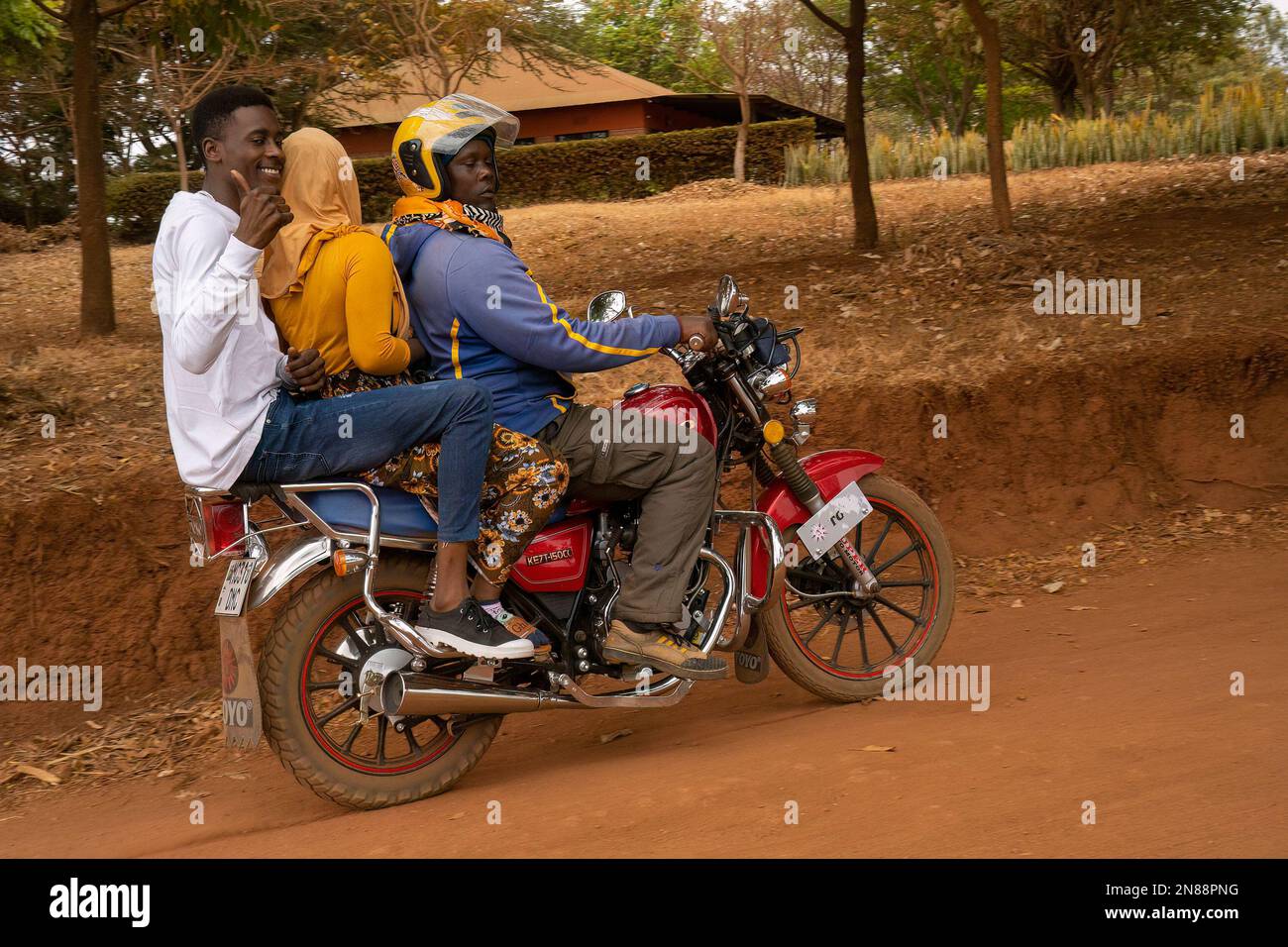 Three people riding a motorcycle hi-res stock photography and images ...