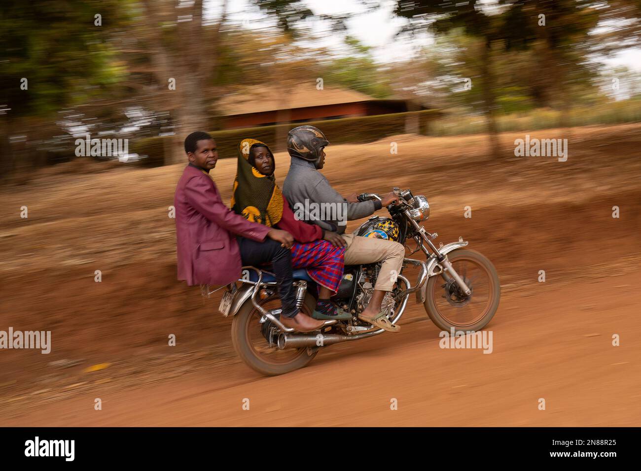 Three people riding a motorcycle hi-res stock photography and images ...