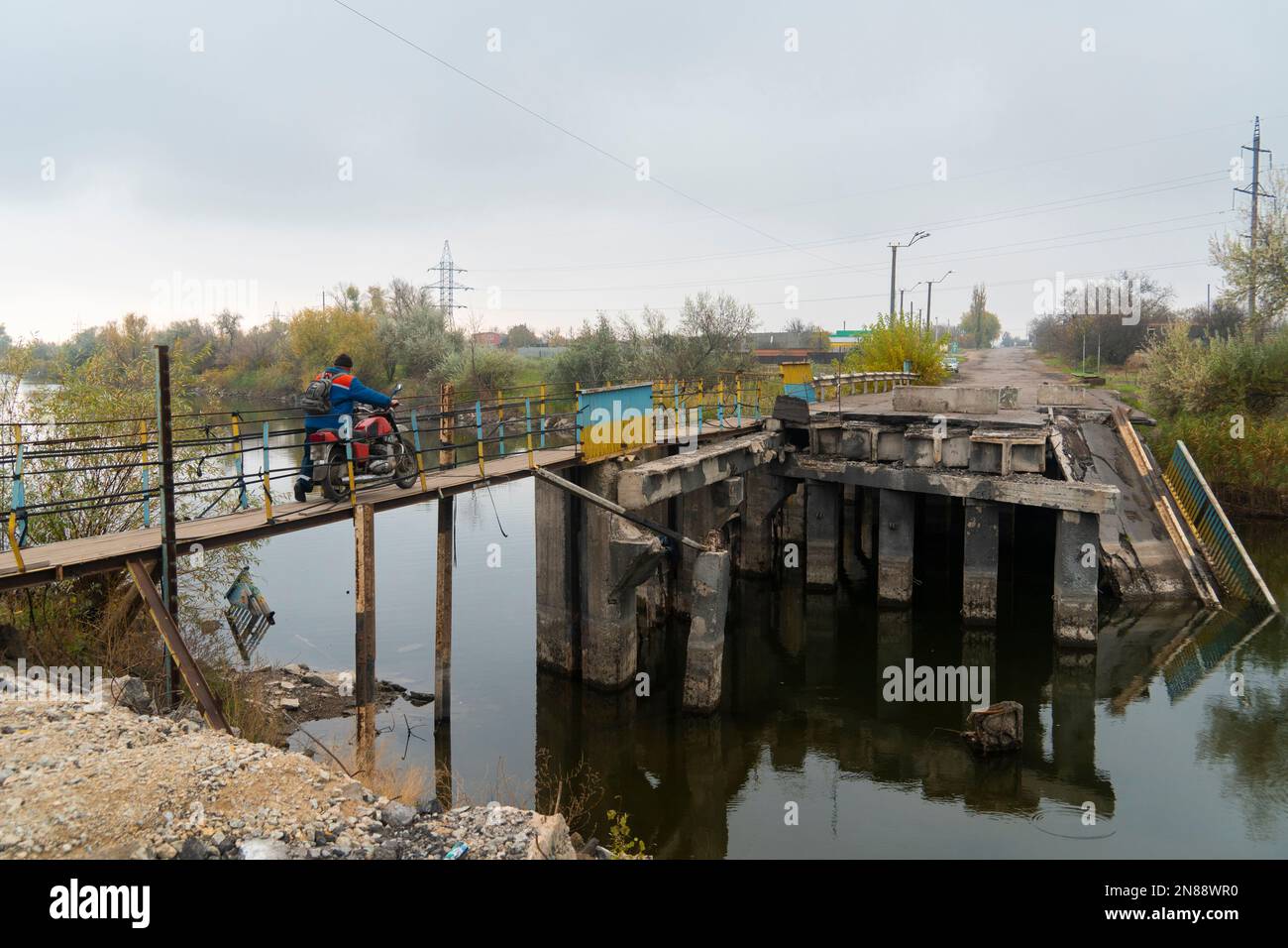 Destroyed bridge across river. War in Ukraine. Russian invasion of ...