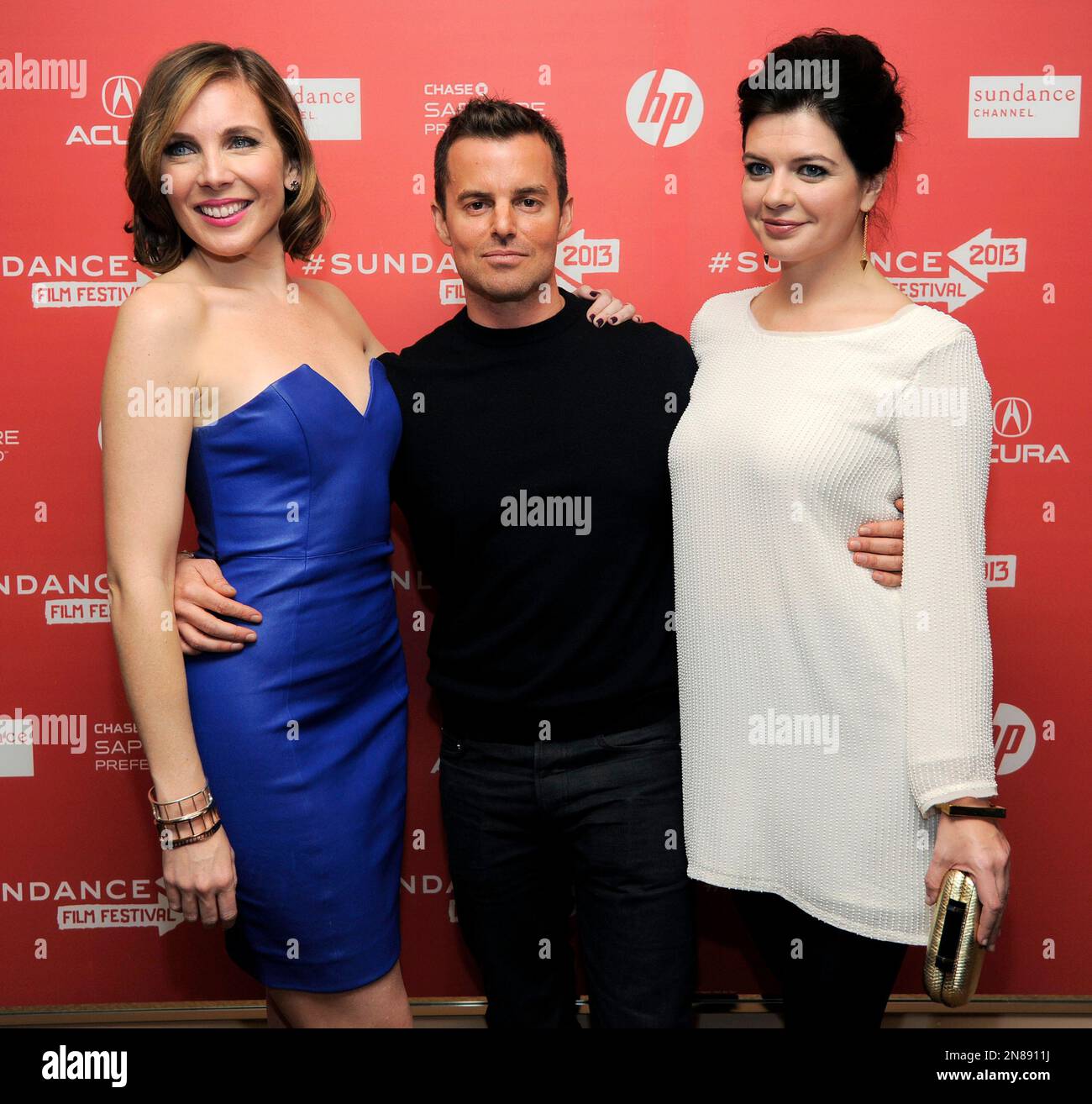Chris Nelson, center, director of "Ass Backwards," poses with cast members June Diane Raphael ...