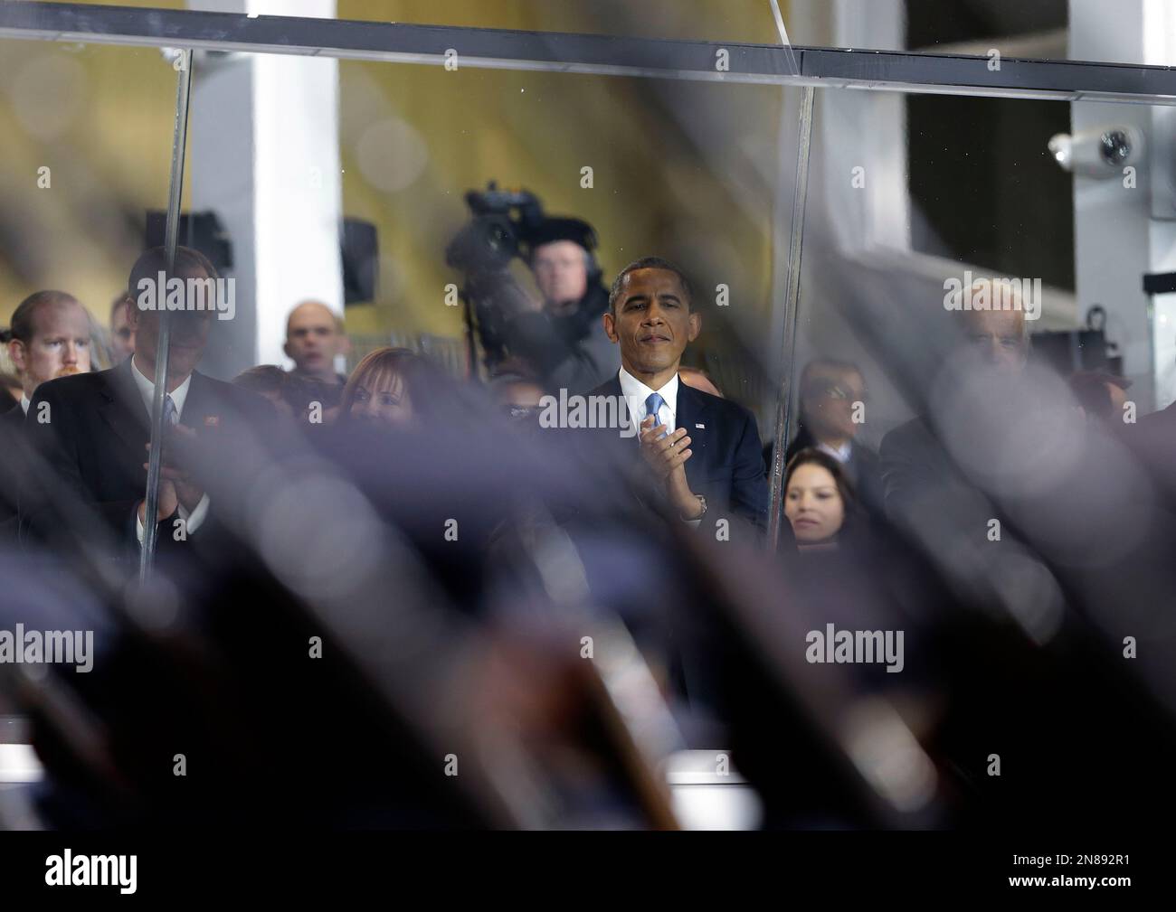 President Barack Obama observes the Inaugural parade walk down ...