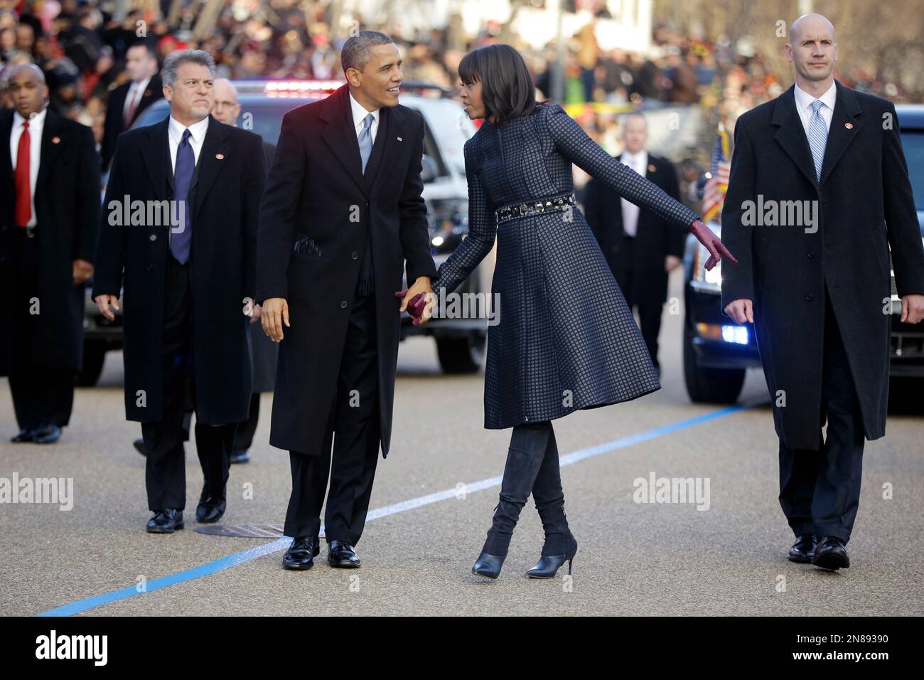 President Barack Obama and first lady Michelle Obama walk in the ...