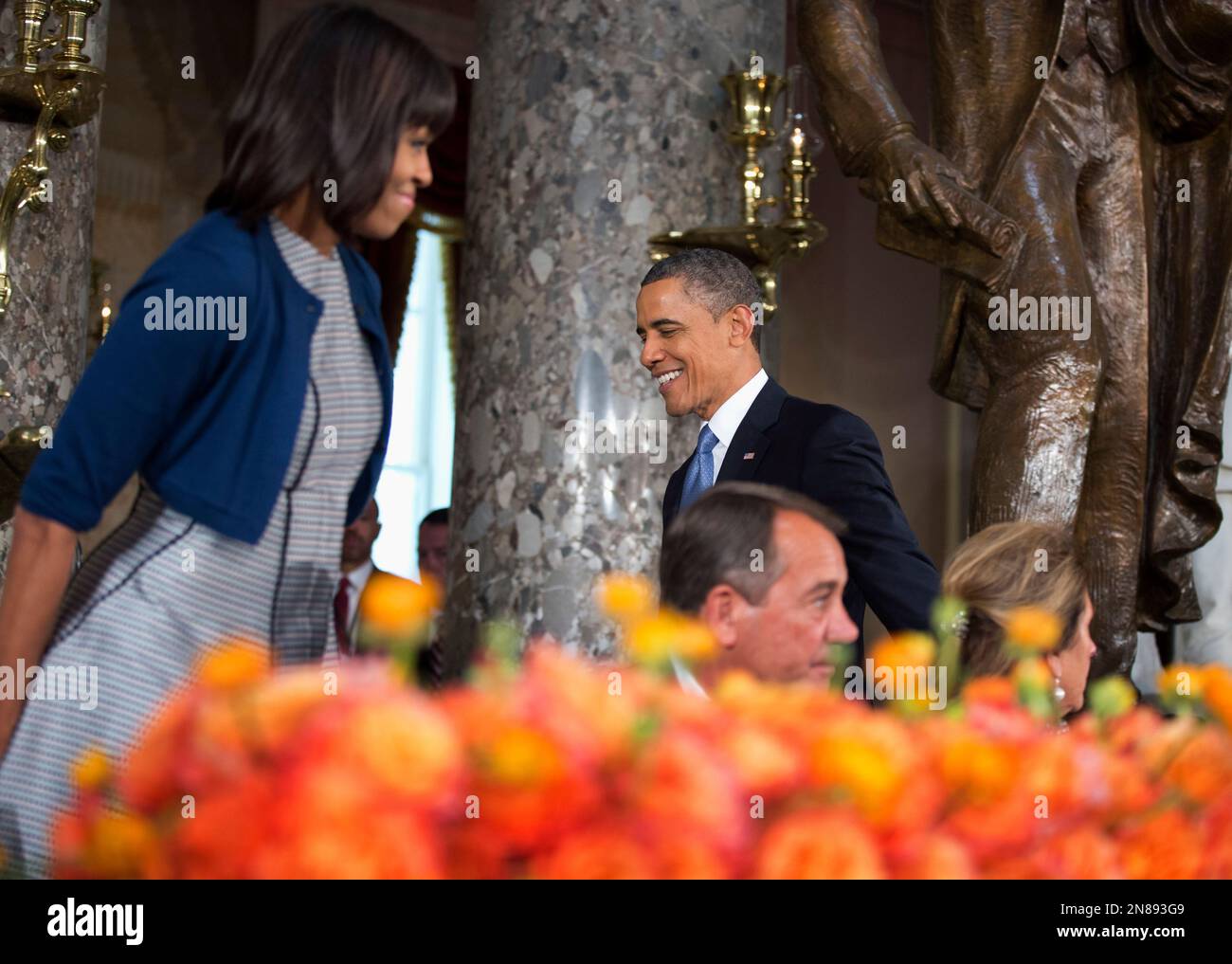 President Barack Obama walks past House Speaker John Boehner of Ohio ...