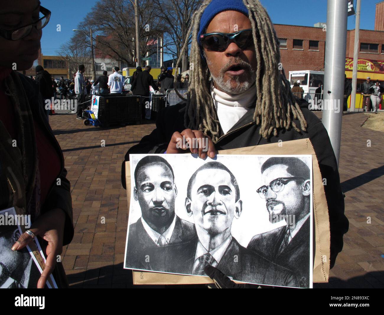 Walter Andrade holds up a picture he drew of Martin Luther King Jr., President Barack Obama and ...